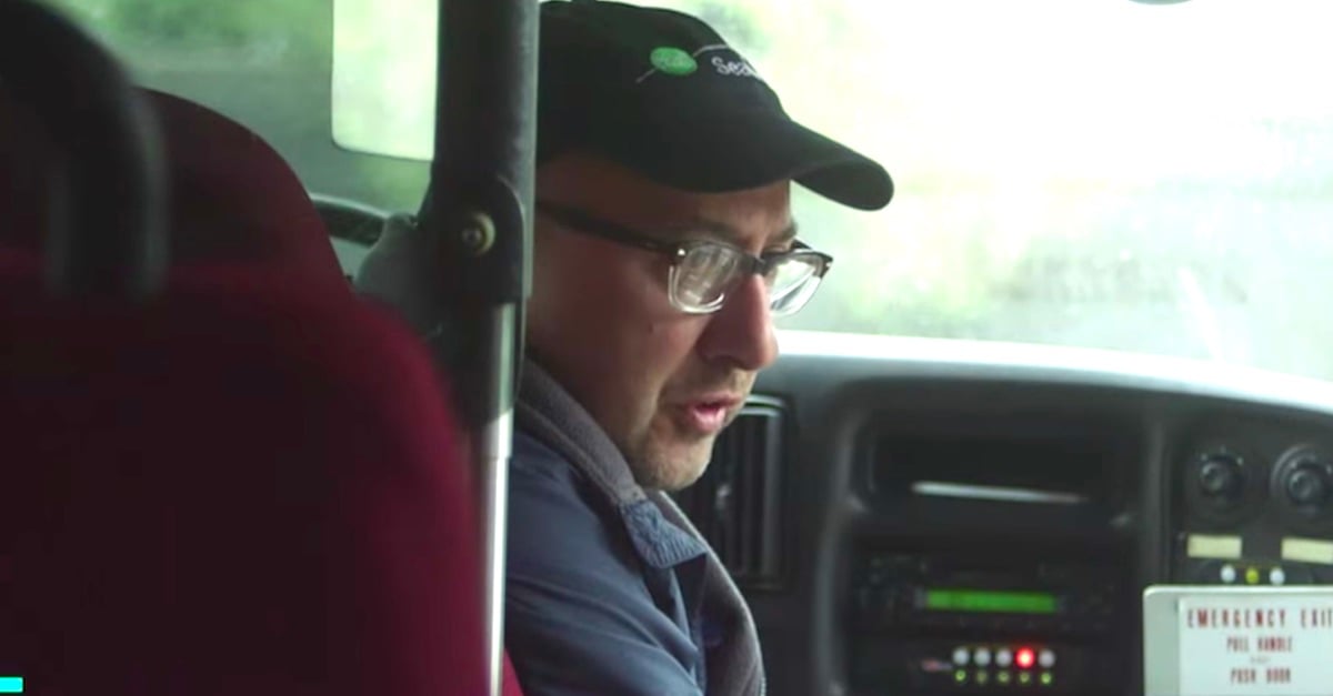 Bus Driver Turns Around In The Driver's Seat. The Passengers Are ...