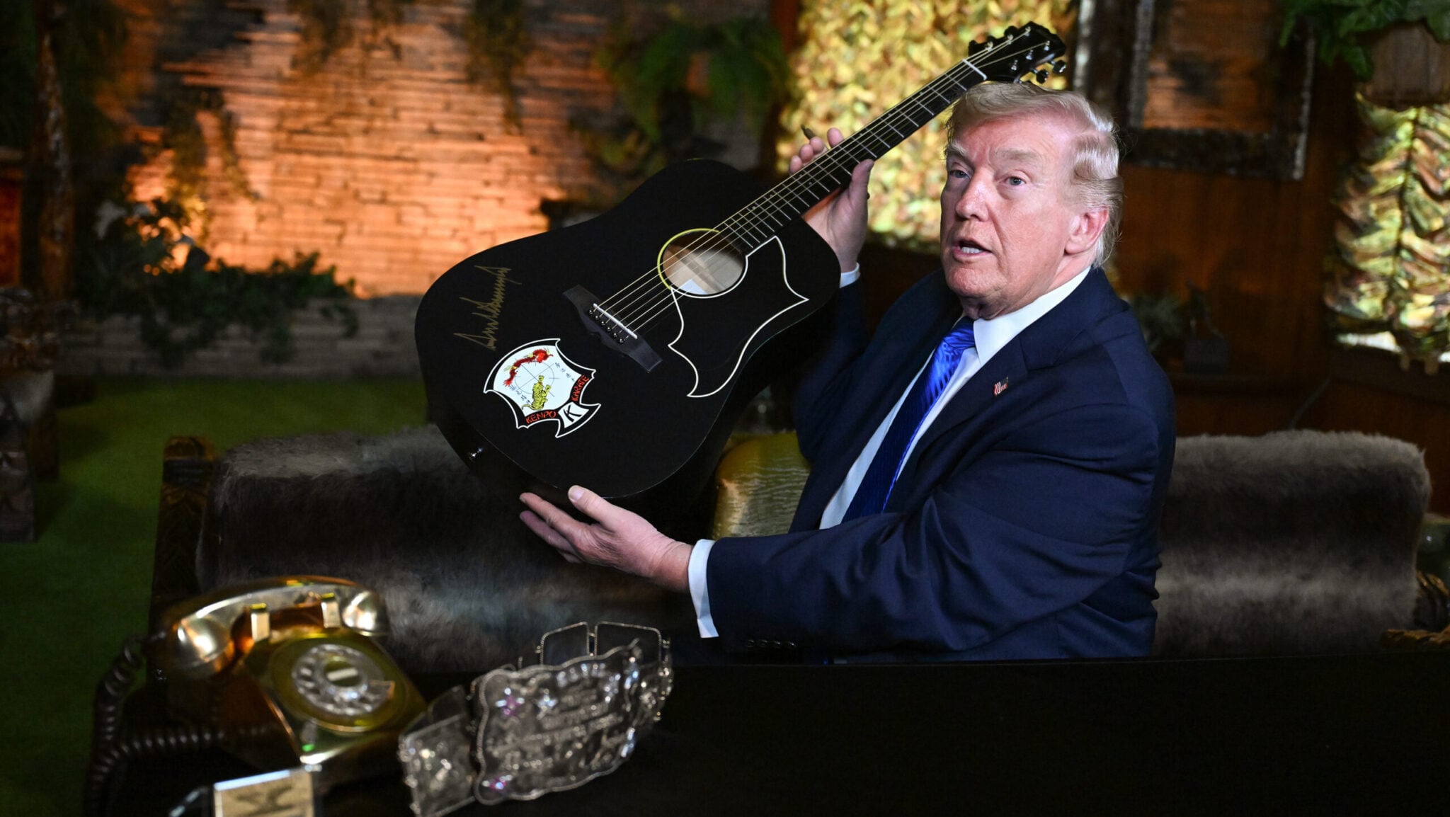 Trump Signs Guitar & Says Biden Couldn't Do the Same